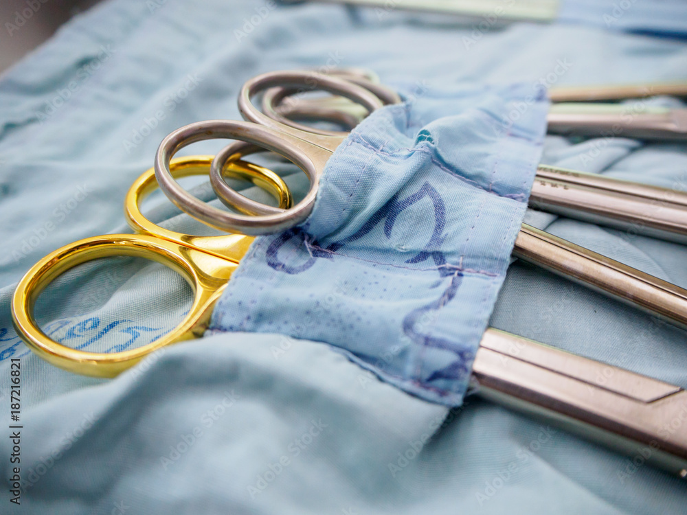 WIde angle close-up of surgical scissors, forceps, and needle holders ...