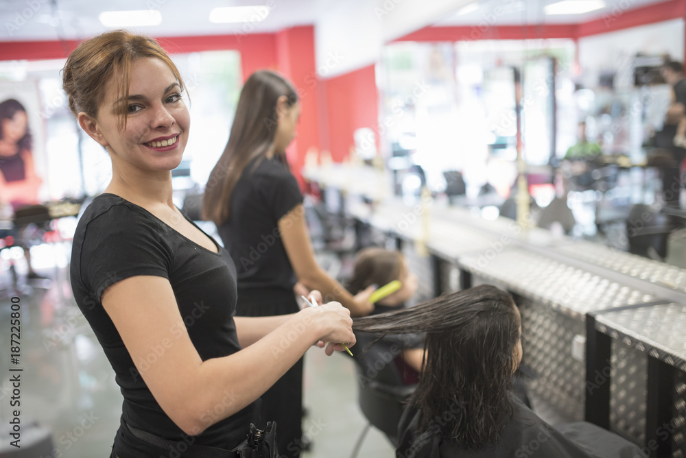 Hairdressers with little girls in beauty center saloon Stock Photo ...