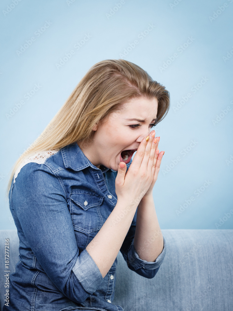 Sad screaming woman holding her nose Stock Photo | Adobe Stock
