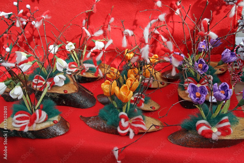 Red and white martenitsi on outdoor market for martenici on the street ...