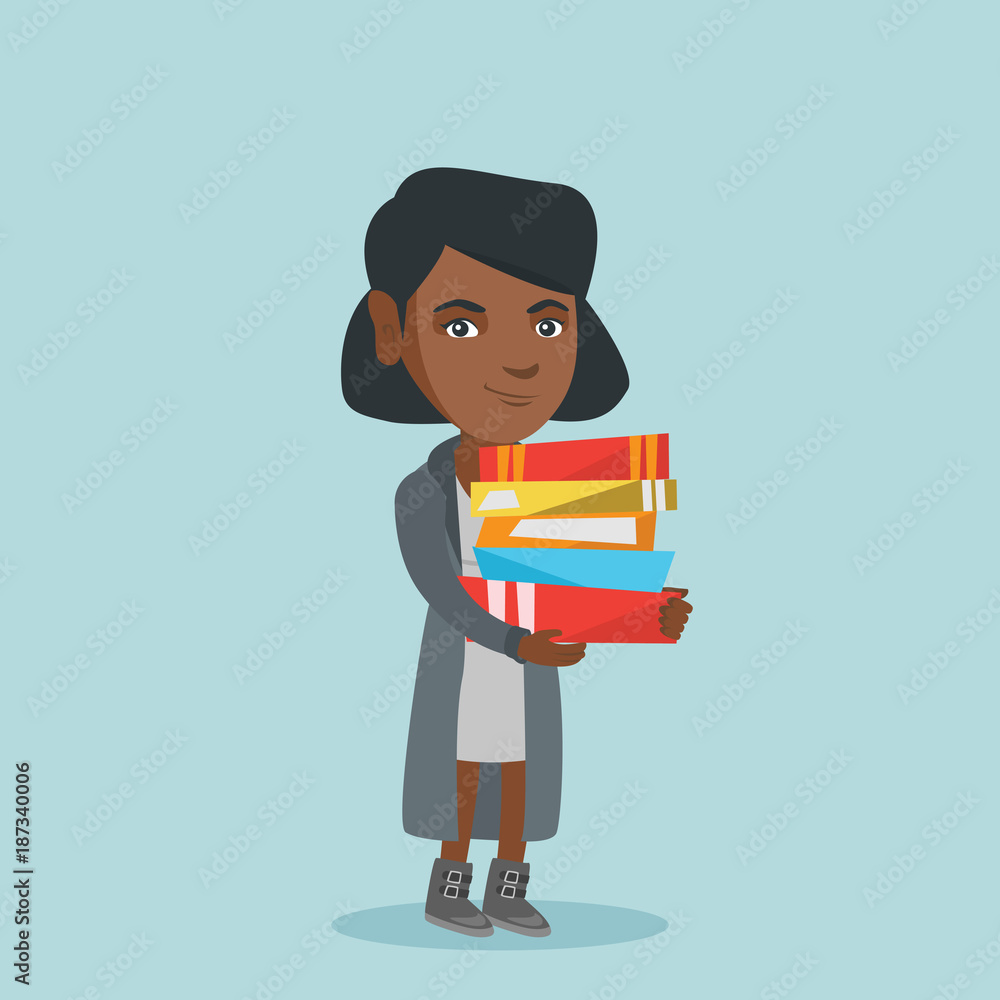 Young african-american student holding a pile of educational books in ...