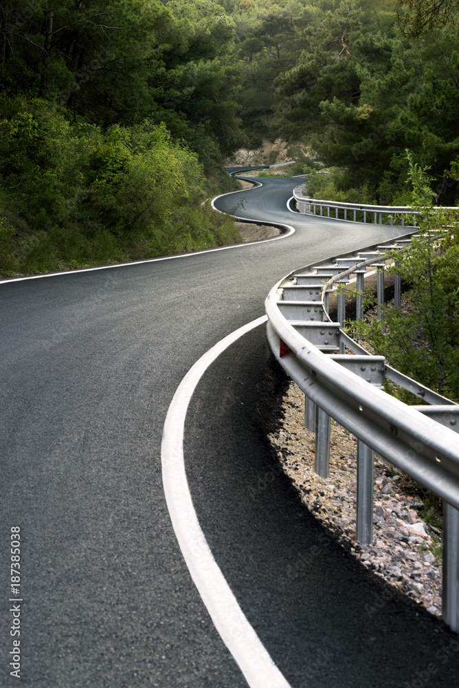 S shaped road in forest. Stock-Foto | Adobe Stock