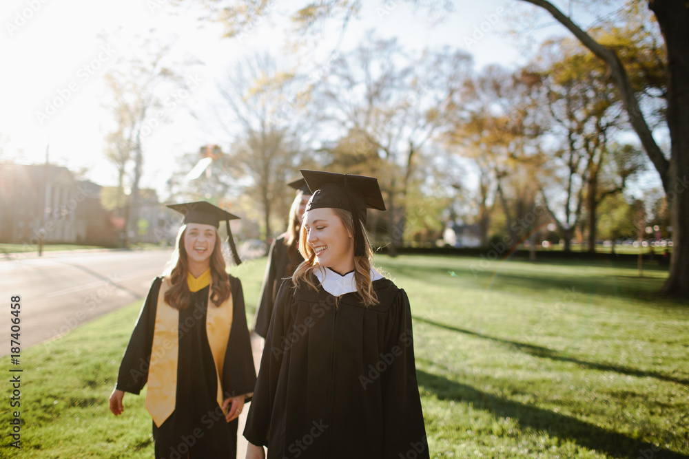 Female Graduates Walking Stock Photo | Adobe Stock