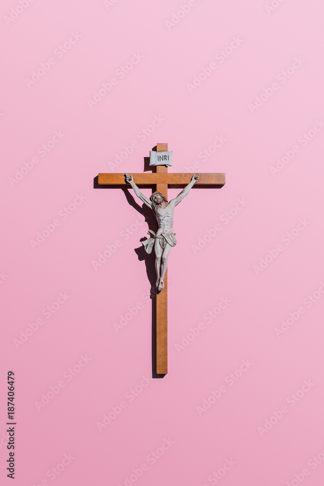 Jesus Christ Crucifix on Pink Background Stock Photo | Adobe Stock