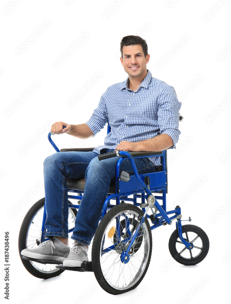 Attractive young man in wheelchair on white background Stock Photo ...