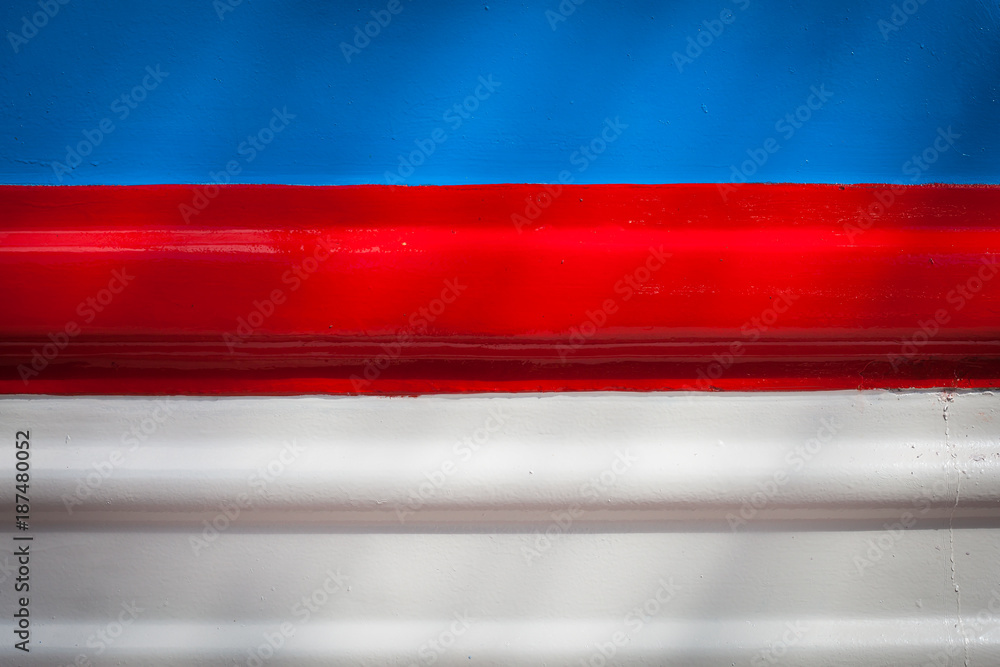 Paint smudges on the surface. The colors of the flag of the Russian ...