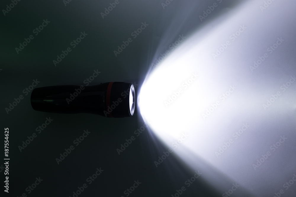 Beam of a flashlight on a white background, light and shadow concepts ...