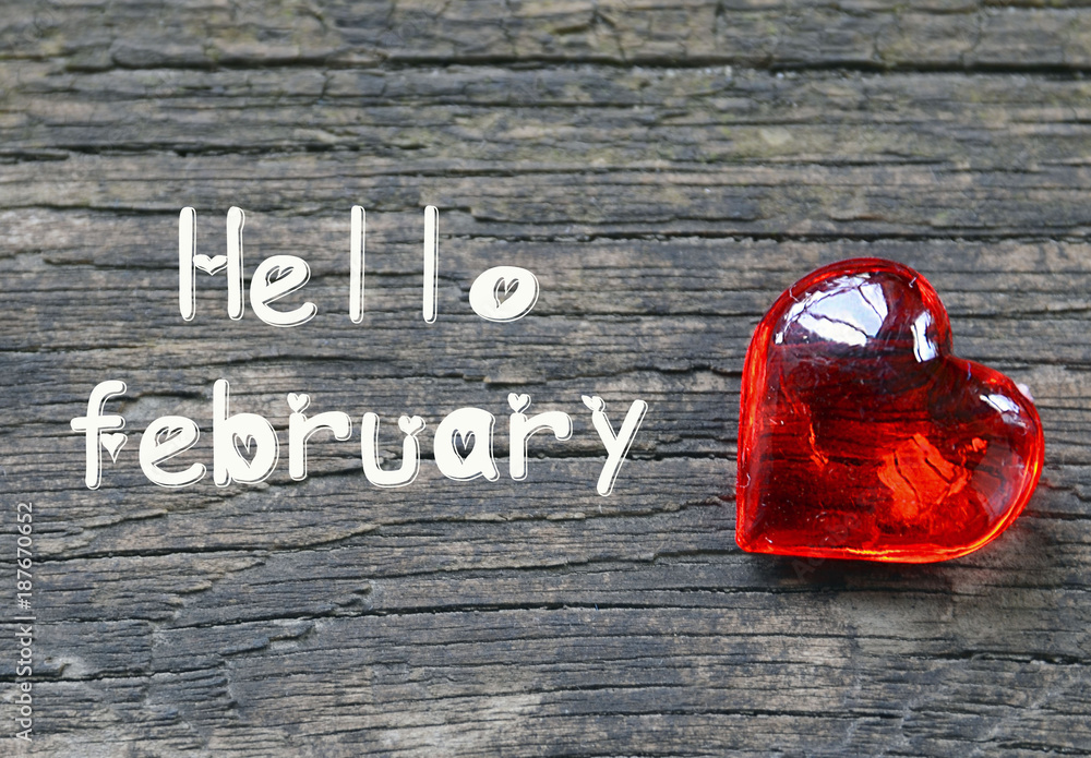 Hello February.Decorative red heart on rustic wooden background.Winter ...