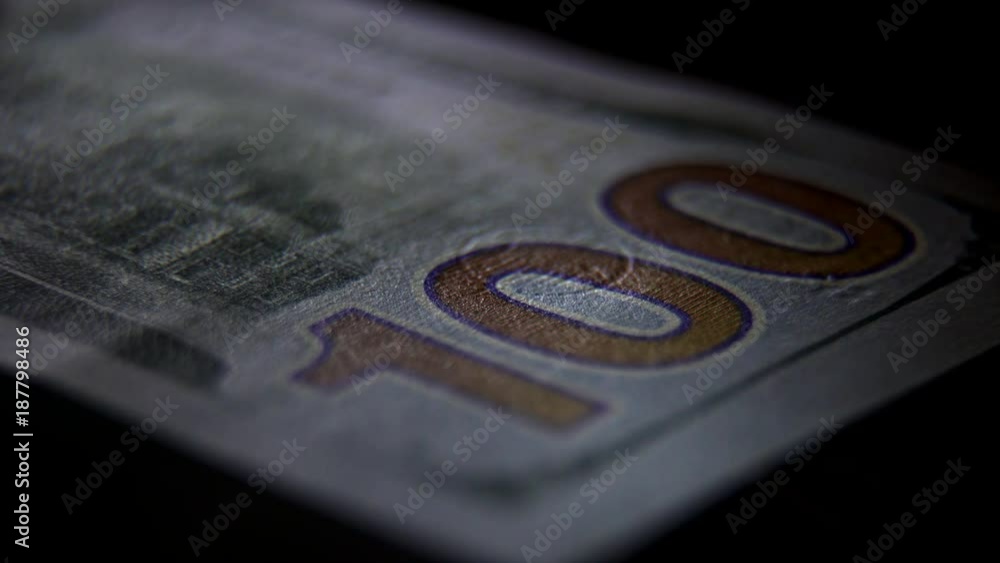 Elements and signs on a 100 banknote: a portrait of the president, a ...