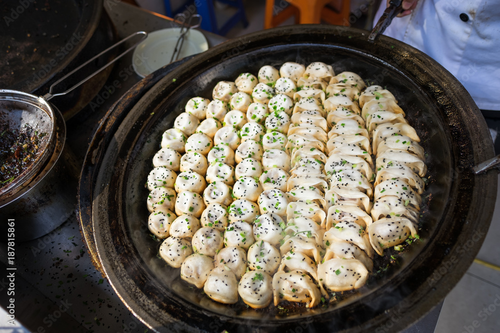 Sheng Jian Bao and Guo Tie being cooked - Shanghai pan fried dumplings ...