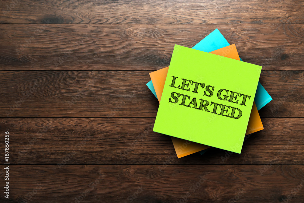 Let's Get Started, the phrase is written on multi-colored stickers, on ...