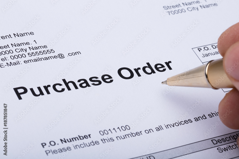 Person Hand Filling A Purchase Order Form Stock Photo | Adobe Stock
