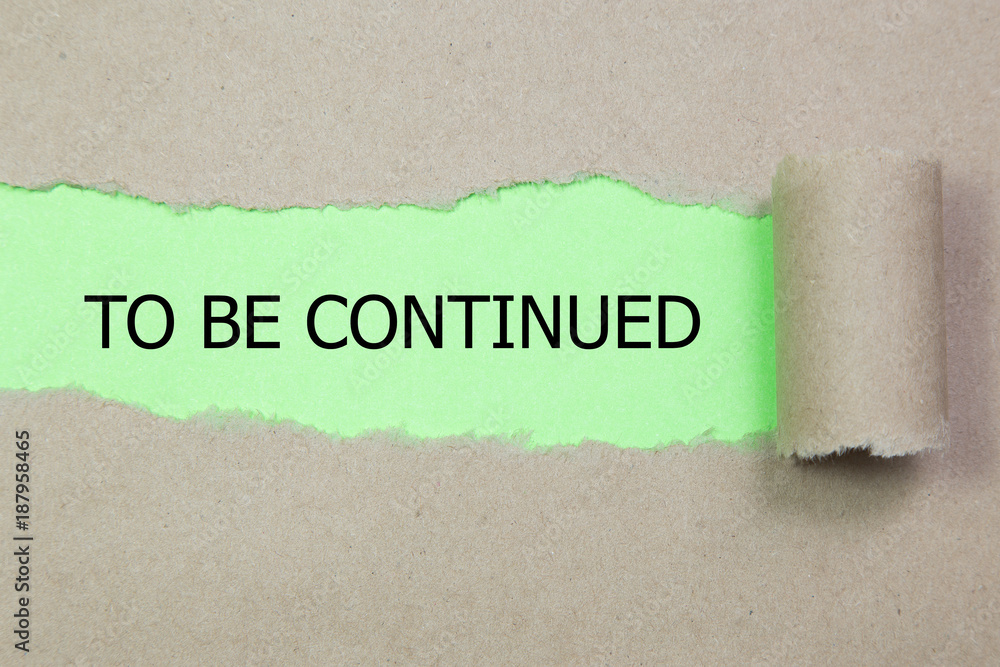 The text to be continued appearing behind torn paper Stock Photo ...