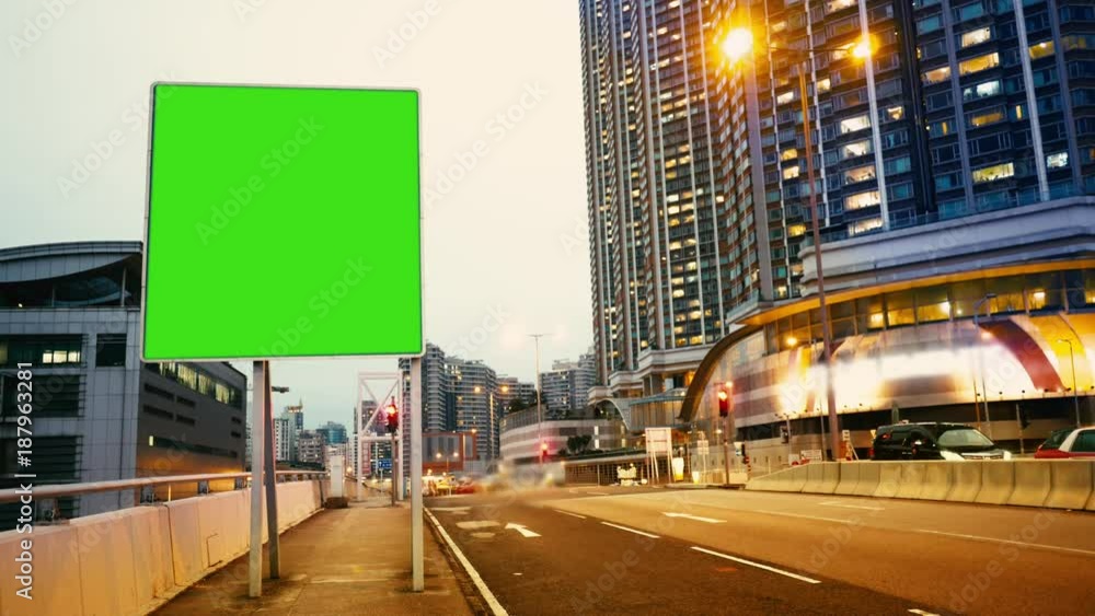 Time Lapse.A Billboard with a Green Screen on a Evening Streets of Hong ...
