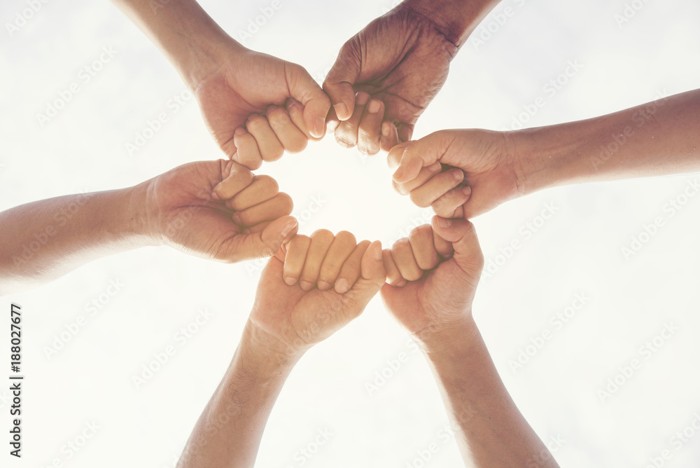 Multiethnic group of young collaboration teamwork standing hands ...