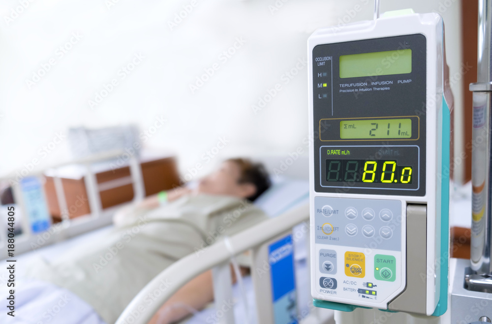 Senior asian woman patient with infusion pump treated in hospital ...