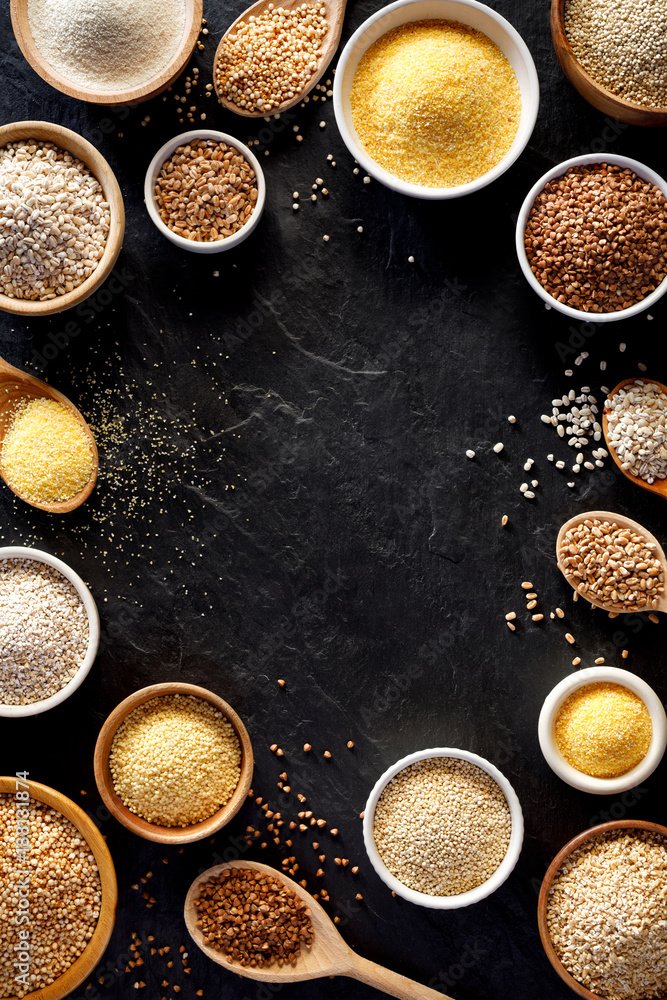 Various groats, cereals. Different types of groats in bowls and on a ...