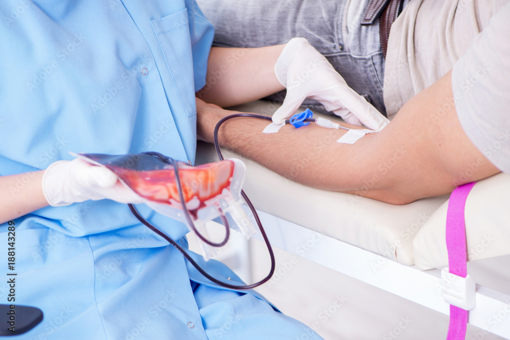 Patient getting blood transfusion in hospital clinic Stock Photo ...
