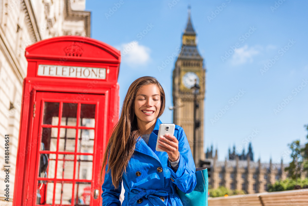 London mobile phone business Asian woman writing text message using ...