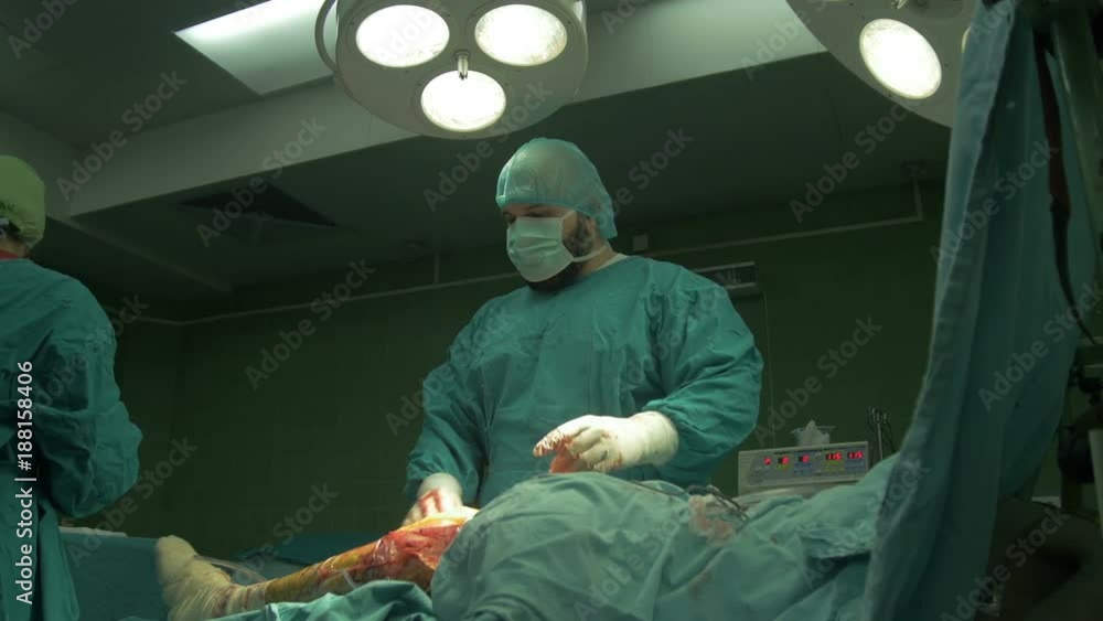 Nurse adding surgeon scissors, needle and thread that using to sewing ...