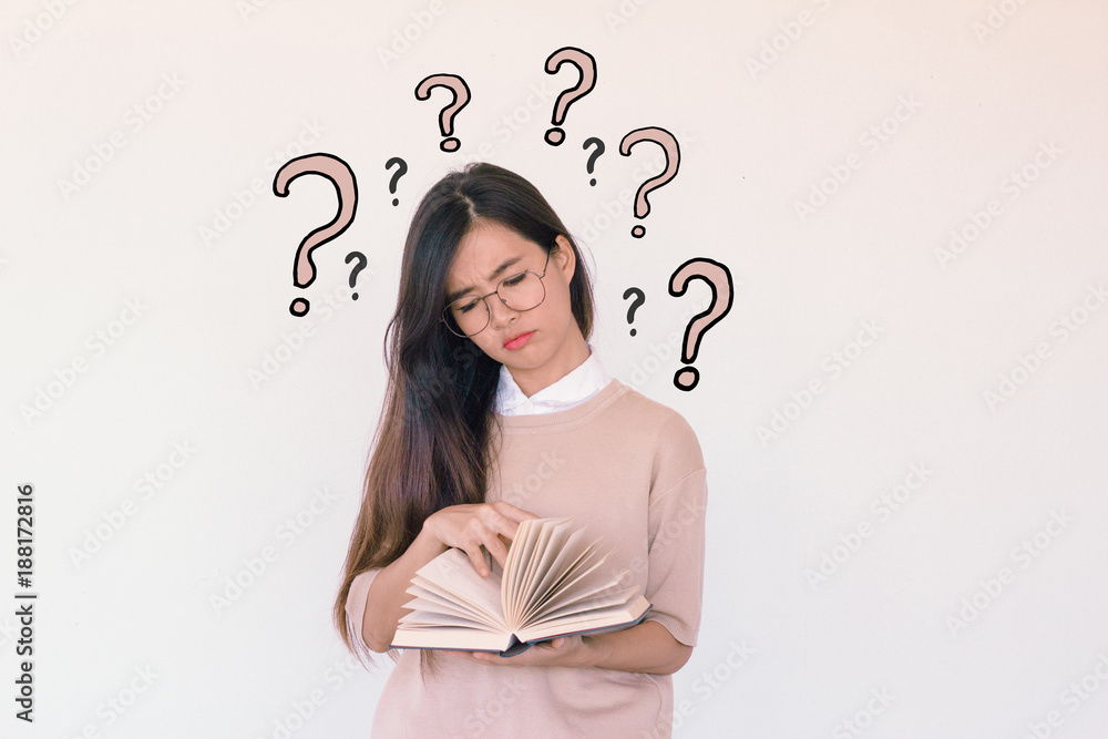 Young asian Student woman holding book and question marks doodles at ...