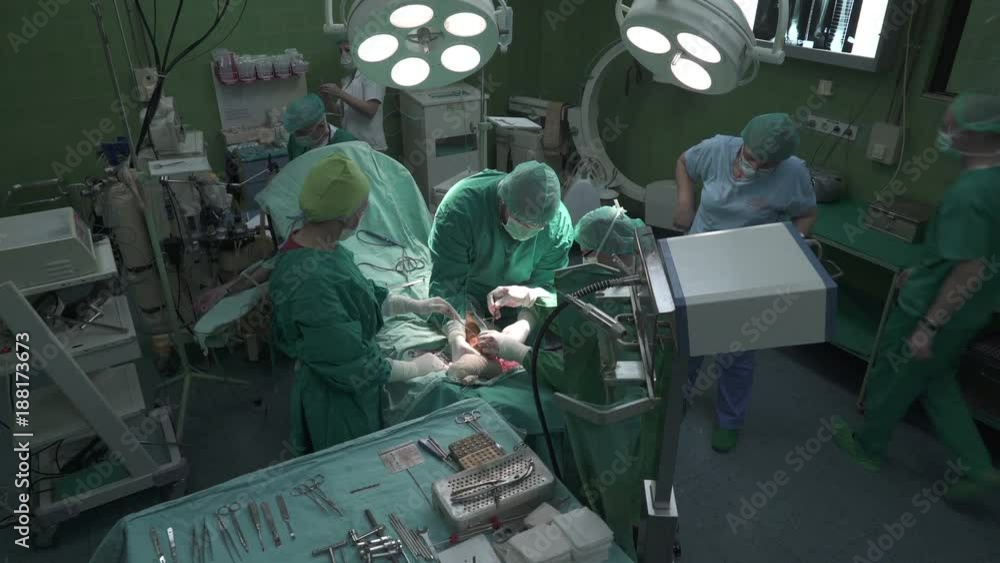 Surgeons orthopedist team using surgical tools and instruments to ...