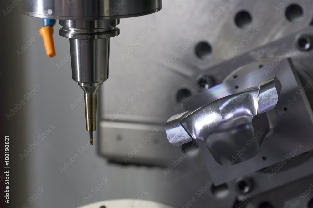 The 5-axis CNC machine cutting the sample part.The aero spaces part ...