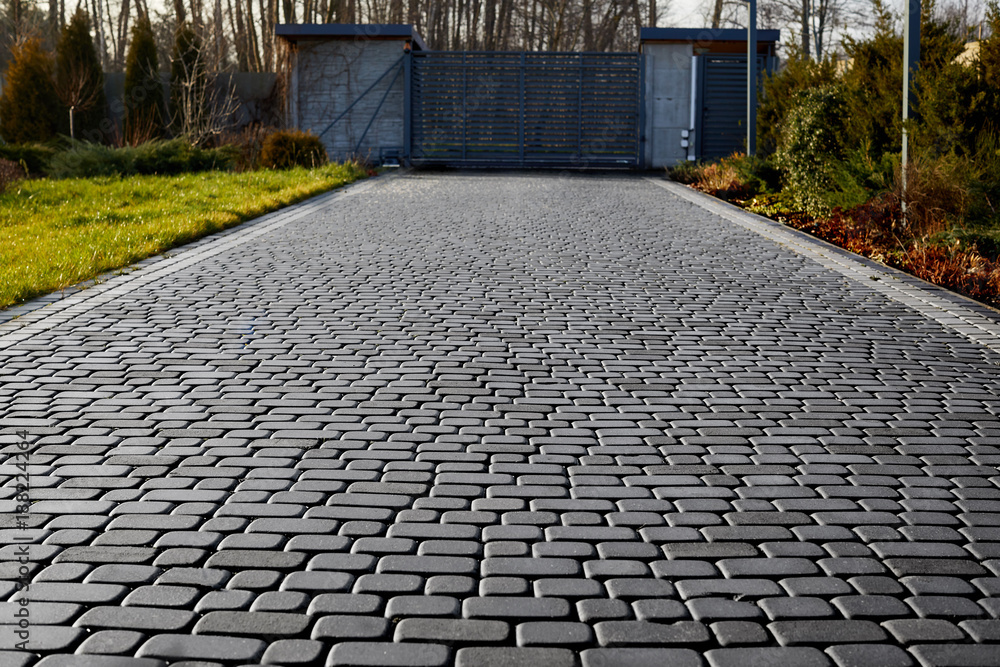 Cobblestone entrance in the garden, graphite paving stone texture ...