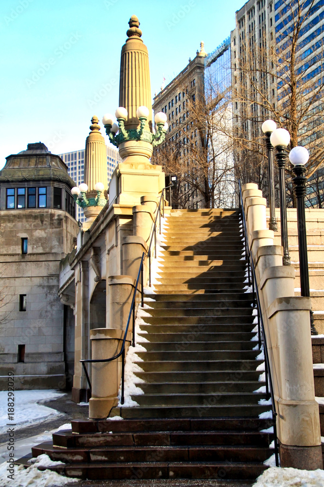 Stone steps alongside a bridgehouse for Chicago River bridge and light ...