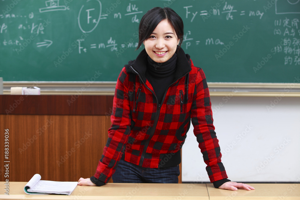 one young asian female teacher in the classroom Stock Photo | Adobe Stock
