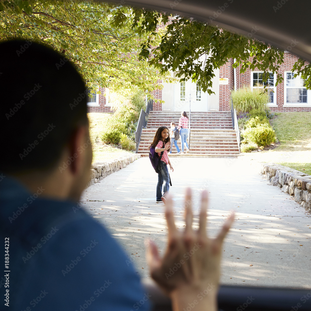 Father In Car Dropping Off Daughter In Front Of School Gates Stock ...
