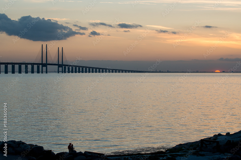 Silhouette of unrecognizable couple in Limhamn, Sweden enjoying sunset ...