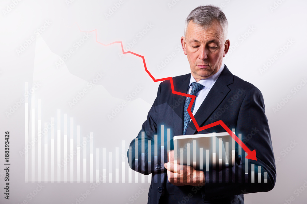Businessman with chart in the fall, economy going down. Stock-Foto ...