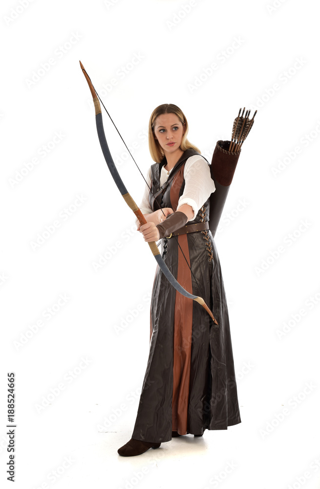 full length portrait of girl wearing brown fantasy costume, holding a ...