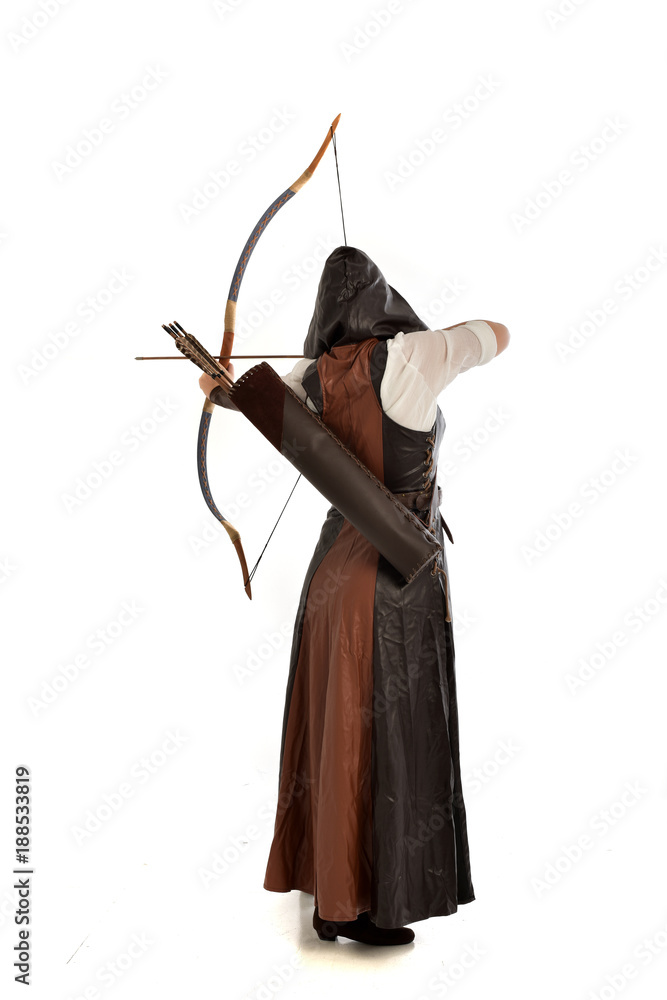 full length portrait of girl wearing brown fantasy costume, holding a ...