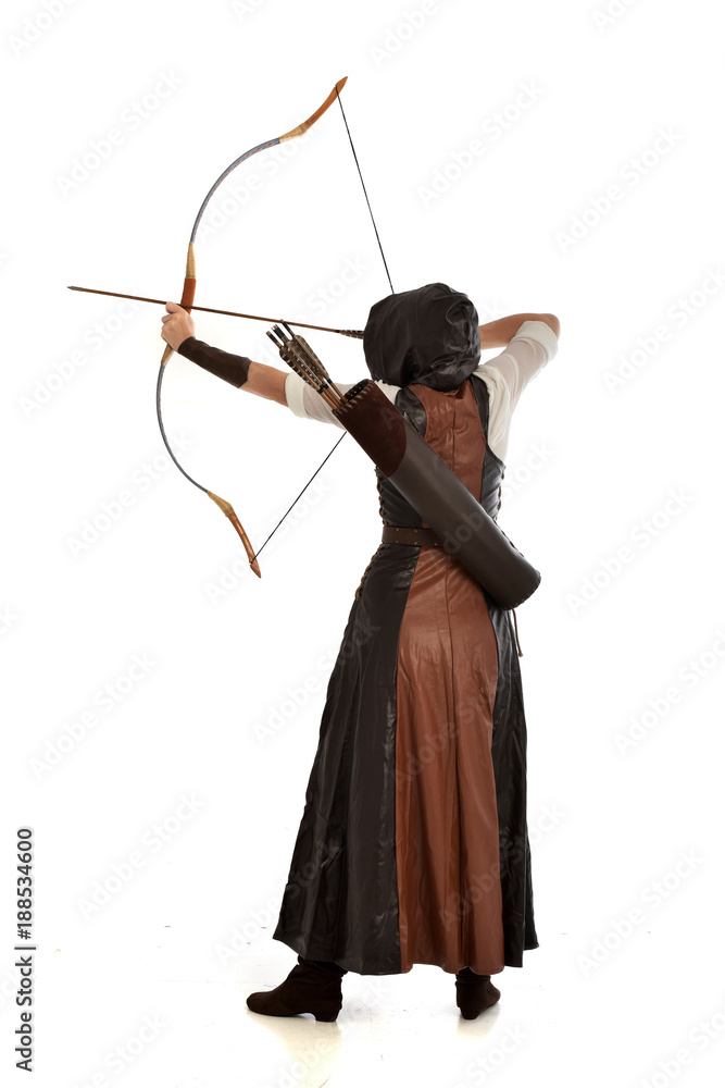 full length portrait of girl wearing brown fantasy costume, holding a ...