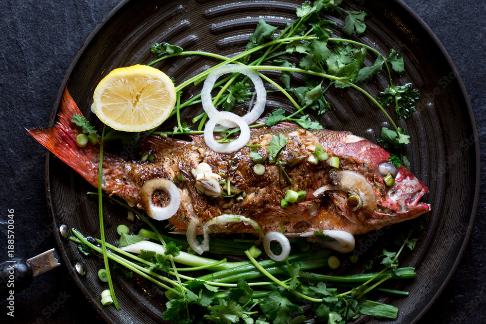 Grilled Whole Red Snapper with Ginger Soy Sauce and Garnish. Served hot ...