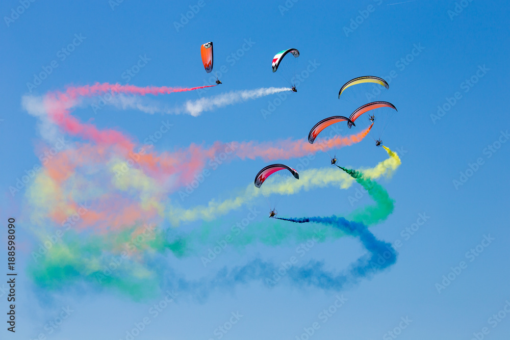 Powered parachutes Air show - multicolored Paratroopers in the sky ...