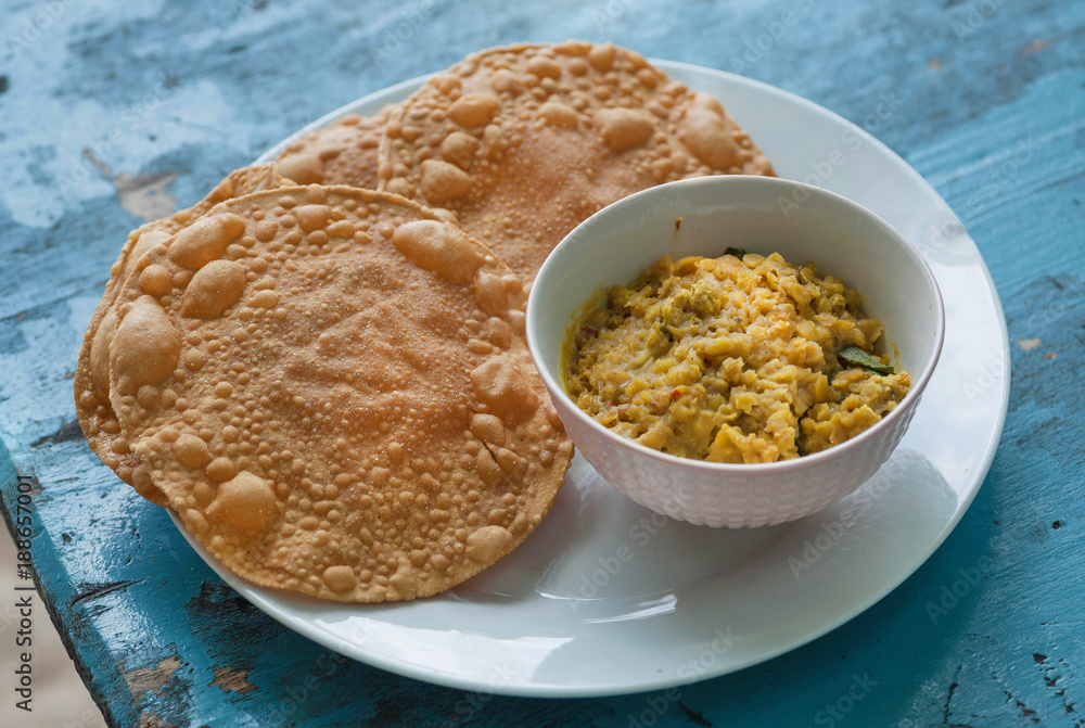 Indian food for breakfast. Papadum bread and vegetarian dal made from ...