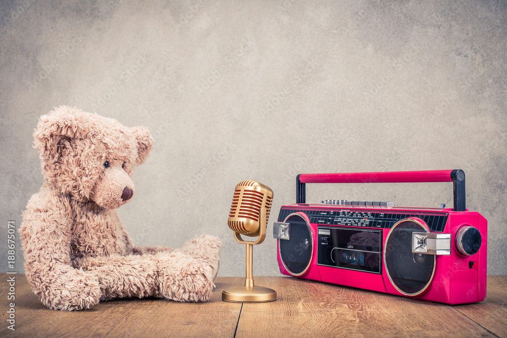 Retro Teddy Bear toy, classic golden mic and old outdated cassette ...