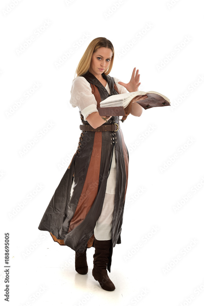 full length portrait of girl wearing brown fantasy costume, holding a ...