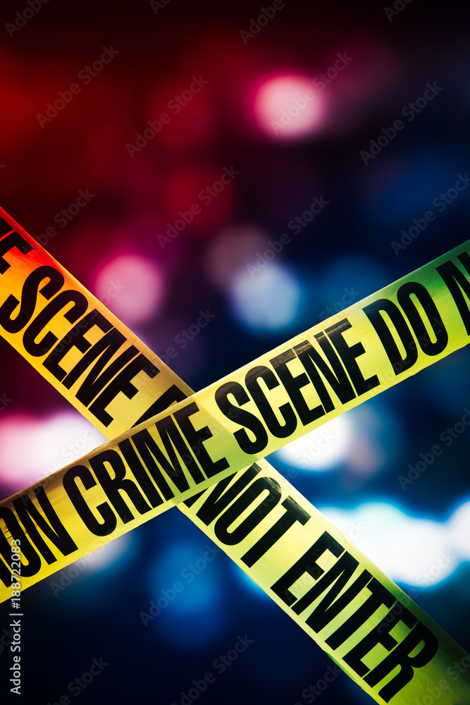 high contrast image of Crime scene tape with red and blue lights on the ...