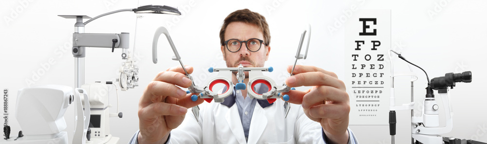 optician hands with trial frame, optometrist doctor examines eyesight ...