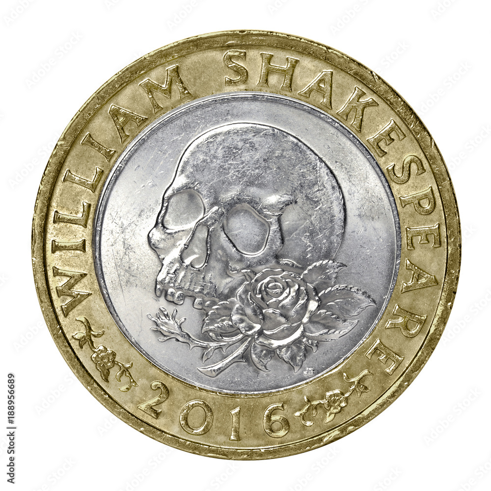 William Shakespeare tragedies two pound coin with skull and rose design isolated on a white ...