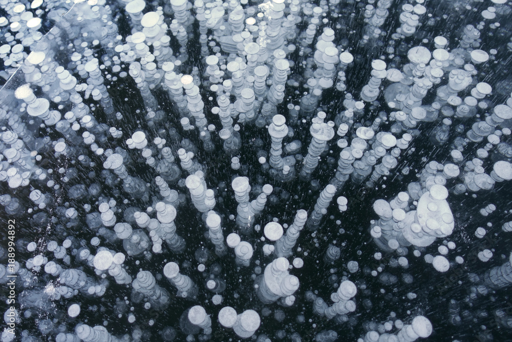Methane bubbles frozen in the ice of Lake Baikal Stock Photo | Adobe Stock