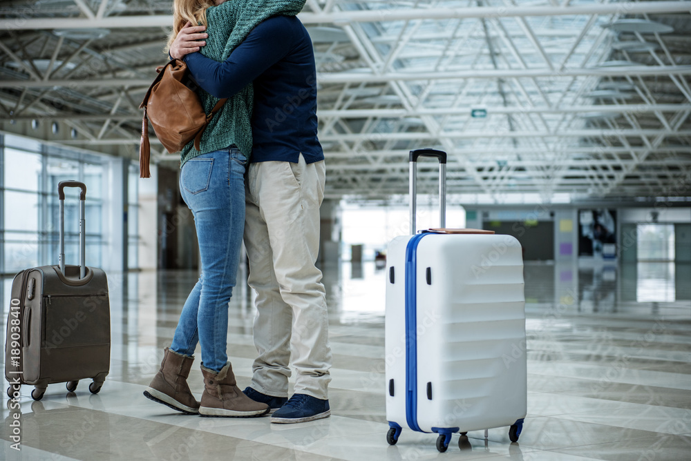 People Hugging Goodbye