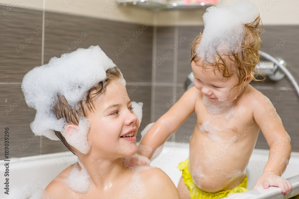 brother and sister bathing in the bathroom Stock Photo | Adobe Stock