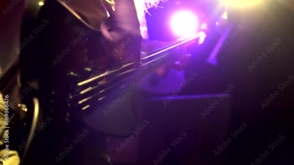 Male rock musician. Rock guitar solo on music concert on stage. Close ...