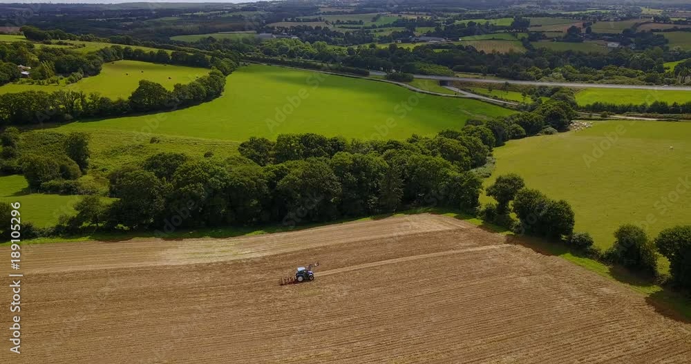 Tractor farming on field landscape Stock Video | Adobe Stock