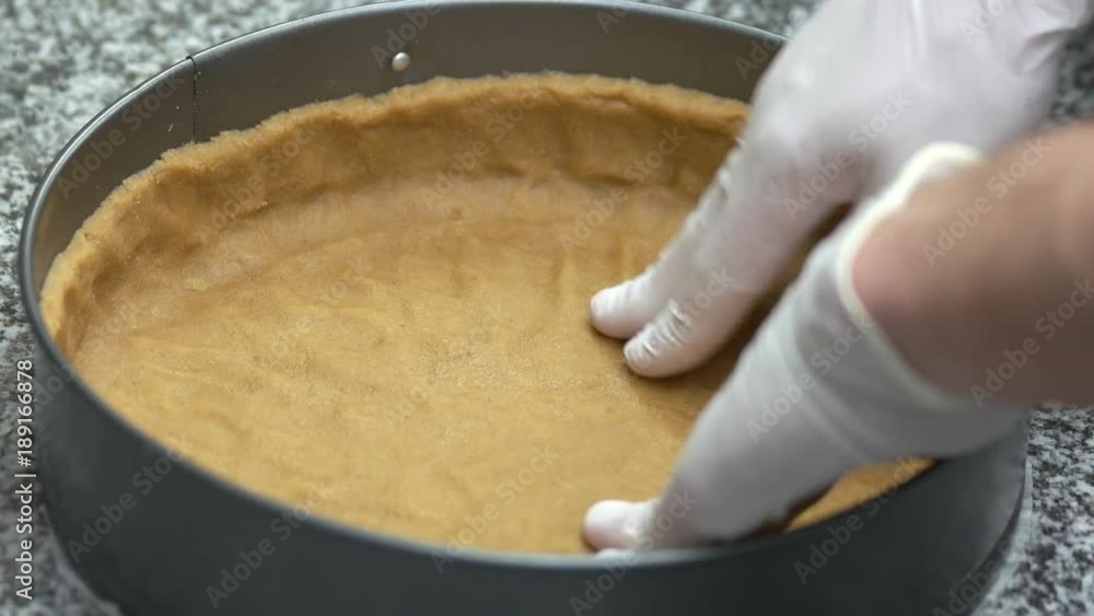 Chef hands pressing pie crust. Close up flaky pie crust kneading in ...